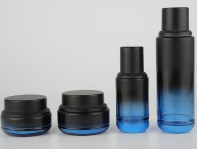China Cosmetic Packaging Glass Lotion Bottle Cream Jar Skin Care Containers With Black Cap for sale