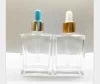 China 30ml 50ml Rectangular Essential Oil Bottles Glass Dropper Bottle With Gold Shinny Collar OEM for sale