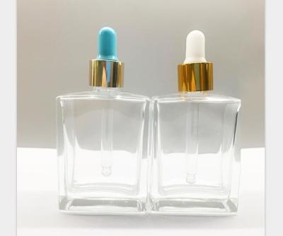 China 30ml 50ml Rectangular Essential Oil Bottles Glass Dropper Bottle With Gold Shinny Collar OEM for sale