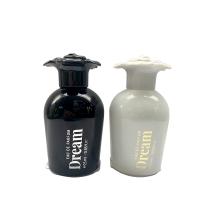 China Custom Glass 50ML Refillable Perfume Bottle With Flower Cap for sale