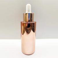 China OEM ODM Rose Gold Electroplating Glass Dropper Bottles Round Shape for sale
