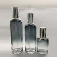 China 40ml 100ml 120ml Glass Lotion Bottle Set With Metallic Silver Shoulder for sale