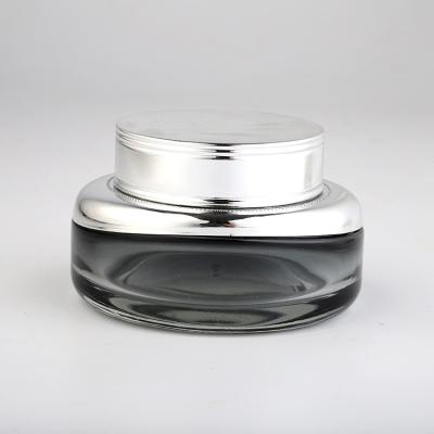 China Silver Shoulder Glass Cream Jars Oval Glass Container Silkscreen Printing Logo for sale