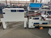 China Automatic Heat Shrink Film Wrapping Machine 220V 50Hz for Industrial Packaging for sale