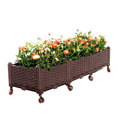 China Self Watering Rectangular Raised Planter Box Storable Plastic Flower Box Planter for sale