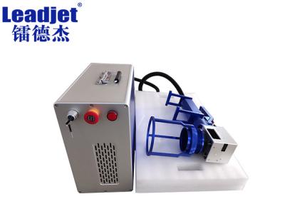China Mini Handheld Portable Fiber Laser Batch Coding Machine Compact Design For Rubber Pipe for sale