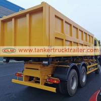 China HOWO 6X4 25m3 Heavy Duty Hook Loader Truck for Construction Waste for sale