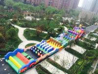 China Commercial Inflatable Obstacle Course 50m x 4m Water Slide Combo with Safety Certification for sale