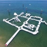 China Commercial Floating Aqua Park PVC Modular Water Recreation Equipment 50m Walkway Slides Platforms for Resort Lake Tourism for sale