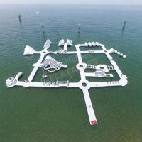 China Commercial Floating Aqua Park PVC Modular Water Recreation Equipment 50m Walkway Slides Platforms for Resort Lake Tourism for sale