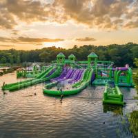 China Custom Large Floating Inflatable Water Park with Multi Lane Slides Towers Obstacles and Aqua Playground Modules for Resorts Lakes Camps and Rental Operations for sale