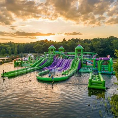 China Custom Large Floating Inflatable Water Park with Multi Lane Slides Towers Obstacles and Aqua Playground Modules for Resorts Lakes Camps and Rental Operations for sale