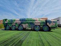 China Custom Inflatable Launcher Vehicle Replica with Long Canister Body Multi Axle Chassis and Camouflage Printing for Training Displays and Outdoor Projects for sale