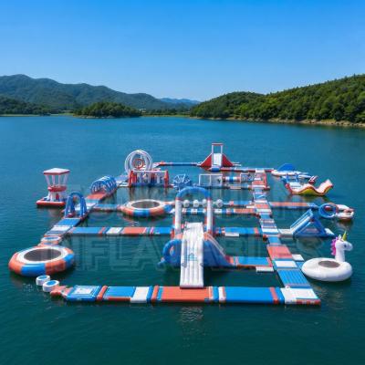 China Custom Modular Inflatable Water Park with Floating Walkways Slides Trampolines and Balance Obstacles for Lakes Resorts Beaches and Commercial Recreation Projects for sale
