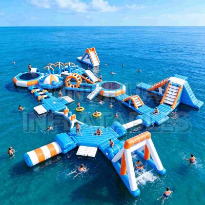 China Large Inflatable Ocean Adventure Park with Modular Slides Trampolines Climbing Elements and Activity Zones for Beaches Hotels and Water Recreation Businesses for sale