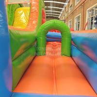 China Colorful Compact Inflatable Obstacle Course with Entrance Arches Climbing Slide and Safety Mesh for Schools Events and Rental Business for sale