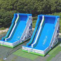 China Commercial K2 Double Lane Inflatable Slide with Mountain Graphics High Side Walls and Safety Landing Areas for Parks Events and Rentals for sale