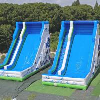 China Commercial K2 Double Lane Inflatable Slide with Mountain Graphics High Side Walls and Safety Landing Areas for Parks Events and Rentals for sale
