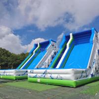 China Commercial K2 Double Lane Inflatable Slide with Mountain Graphics High Side Walls and Safety Landing Areas for Parks Events and Rentals for sale