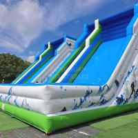 China Commercial K2 Double Lane Inflatable Slide with Mountain Graphics High Side Walls and Safety Landing Areas for Parks Events and Rentals for sale