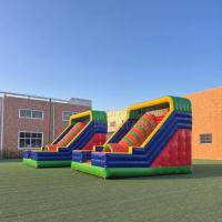 China Commercial Colorful Double Lane Inflatable Slide Set with High Side Walls Climbing Steps and Safety Landing Area for Events and Rentals for sale