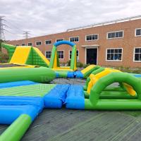 China Commercial Modular Inflatable Water Park with Trampoline Slides Bridges Climbing Obstacles and Custom Lake Layout for sale