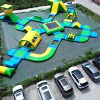 China Commercial Modular Inflatable Water Park with Trampoline Slides Bridges Climbing Obstacles and Custom Lake Layout for sale