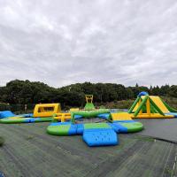China Commercial Modular Inflatable Water Park with Trampoline Slides Bridges Climbing Obstacles and Custom Lake Layout for sale