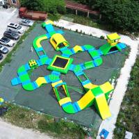China Commercial Modular Inflatable Water Park with Trampoline Slides Bridges Climbing Obstacles and Custom Lake Layout for sale