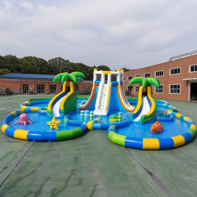 China Commercial Tropical Modular Inflatable Land Water Park with Triple Slides Splash Pools and Sea Animal Play Features for sale