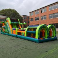 China Commercial Neon Jungle Custom Inflatable Obstacle Course with Tunnels Climbing Wall Slide and Safety Mesh for sale
