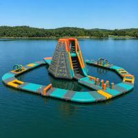 China Commercial Summit Adventure Floating Inflatable Water Park with Dual Racing Slides Climbing Tower Balance Obstacles and Modular Walkways for sale
