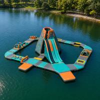 China Commercial Summit Adventure Floating Inflatable Water Park with Dual Racing Slides Climbing Tower Balance Obstacles and Modular Walkways for sale