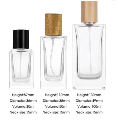 China 100ml 50ml 30ml Clear Perfume Bottle Portable Square Empty Glass Perfume Atomizer Bottle with wood cap for sale