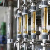 China Environmentally Friendly Brown Liquid Catalase Textile Enzyme Soluble in Water for Peroxide Killing for sale