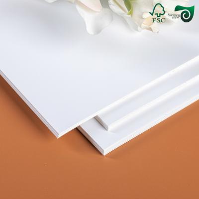 China FSC C1S Art Board SBS Paper Board Premium One Sided Coated Glossy White Ivory Paper for sale