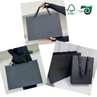 China FSC 120g 180g Virgin Pulp Solid Black Paper High Burst Resistance For Premium Shopping Bags for sale