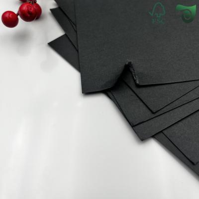 China FSC 300gsm 350gsm Uniform Black Paper  70cm 100cm  High Rigidity For Hang Tags for sale