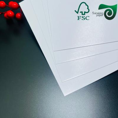 China 300gr 310gr Double Sided Glossy Cardboard Paper 70cm 100cm Kink Resistant for sale