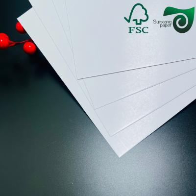 China Black Core Paper 310 Grams For Game Card 550mm 790mm Superior Smooth Glossy Art Paper for sale
