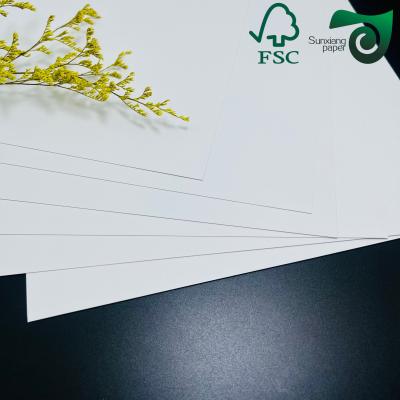 China FSC Certified Bright White C1S SBS Paper Board 210grs 260grs Ideal For Folding Cartons for sale