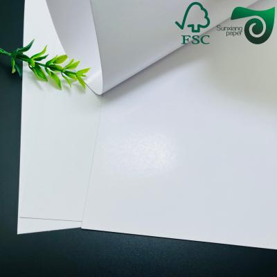 China FSC Certified C2S Brilliant Gloss Couche Paper 100gsm 157gsm White Coated Cardboard for sale