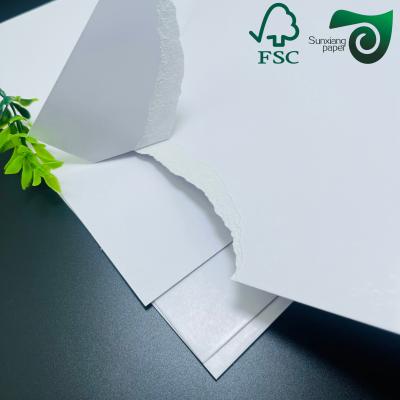 China 100% Virgin Wood Pulp High Brightness White Cardboard Roll 290gsm to 320gsm for Premium Packaging and Printing for sale