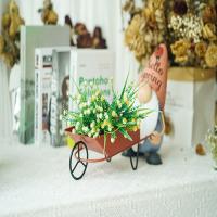 China Recycled Small Metal Garden Ornaments Gnome Pushing The Cart With Planter for sale
