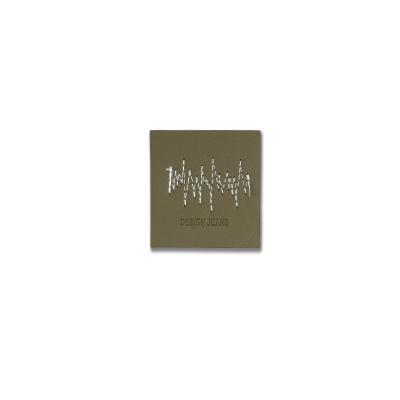 China Custom Green Jeans Leather Label Tag Sewn Closure Type For Clothing for sale