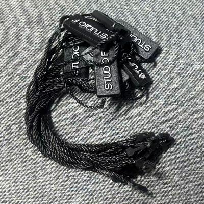China Plain Black Hang Tag String Quantity 100 Pieces Thickness 0.2mm Suitable for in Apparel Accessories and Product Packaging for sale