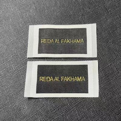 China Ultrasonic Cut With End Fold Woven Clothing Labels Customized Soft Fabric Tags Ideal for Clothing Branding and Textile for sale