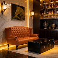 China Luxury Vibrant Orange Leather Chesterfield Wingback 3 Seater Sofa All-over Tufted Sponge-Filled Set for Modern Boutique Hotel for sale