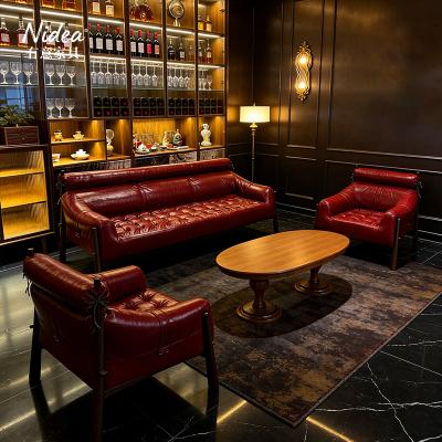 China Modern Luxury Wine Red Top Grain Leather 3-Seater Sofa Set with Avant-garde Tufted Design Cylindrical Bolster Headrest Wood Legs for sale
