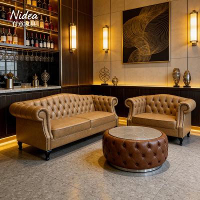 China Luxury Vintage Tan Genuine Leather Chesterfield Sofa Arched Camel Back 3 Seater Tufting Nailhead Trim Sponge Filled Hotel Use for sale